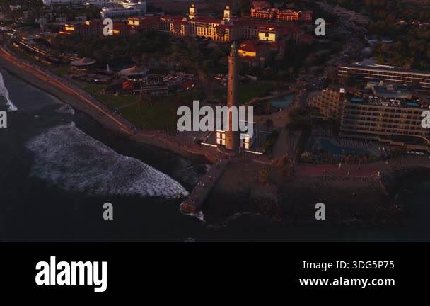 Aerial view of Maspalomas Lighthouse on a short pier in Gran Canaria ...