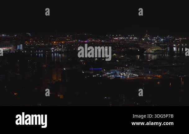 Aerial 4K night view of Las Palmas de Gran Canaria port and marina ...