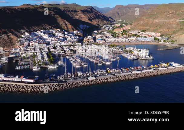 Aerial view of Puerto de Mogan, Gran Canaria shows a dense marina ...