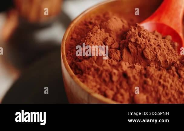 Using cocoa powder for dessert recipes in a kitchen setting Stock Video ...
