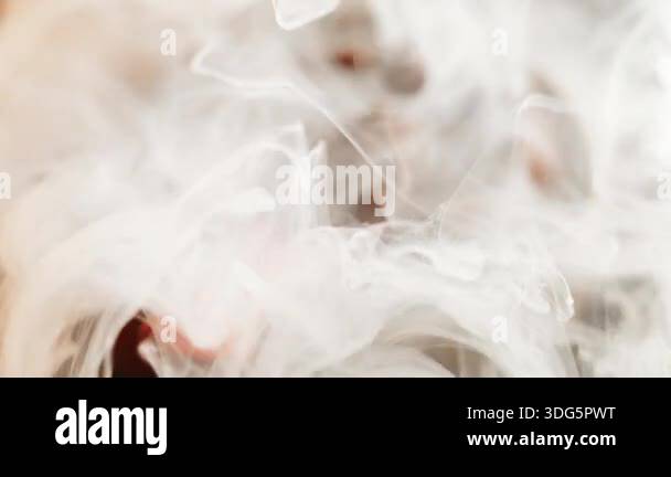 Cocoa powder in a wooden bowl with a spoon showing its rich texture and ...