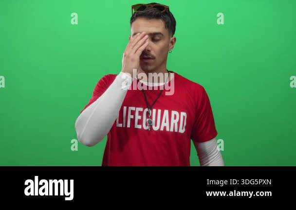 Young hispanic man lifeguard with hand covering face looking concerned ...