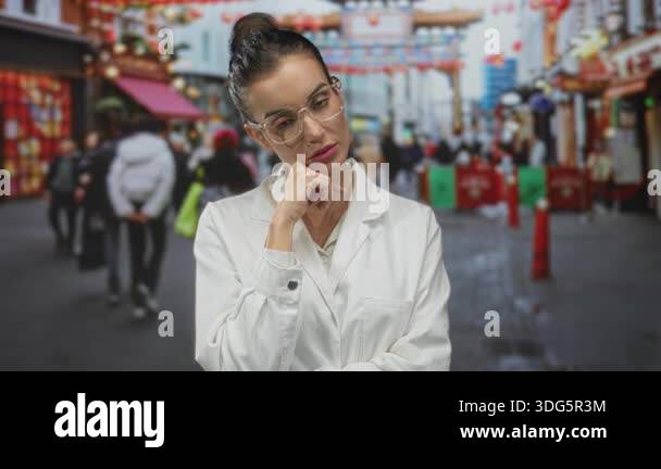 Young hispanic woman scientist in white lab coat wearing clear glasses ...