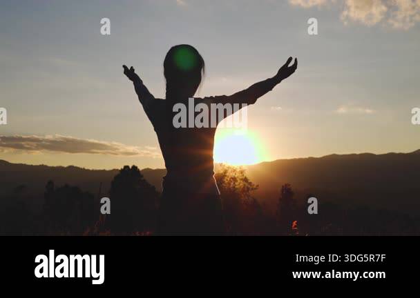 Video 4k Slow motion, Silhouette of woman Praying hands with faith in ...