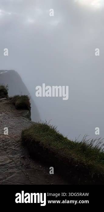 A mysterious mountain landscape features a winding stone path leading ...