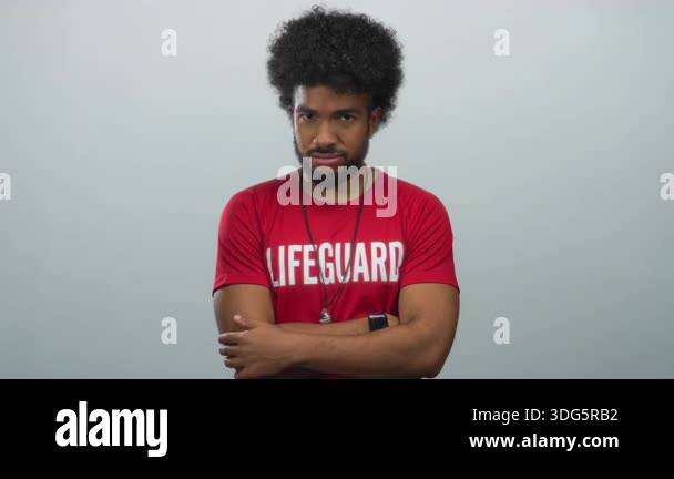 African american man lifeguard in red shirt with pensive expression ...