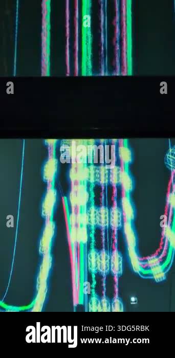 A digital image displays abstract, glowing patterns of teal and yellow ...