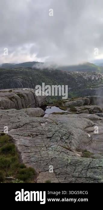 A mysterious mountain landscape features a winding stone path leading ...