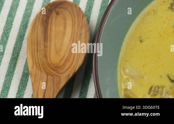 Chicken soup with coconut milk and curry Stock Video Footage - Alamy