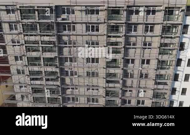 Aerial view of residential apartment building during facade works ...