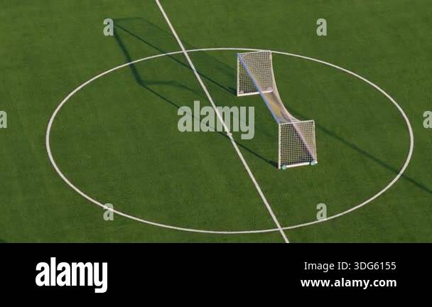 Drone orbit around small football goal placed on synthetic grass ...