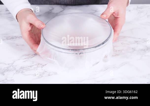 A close-up video clip showing a single fresh strawberry in a glass bowl ...