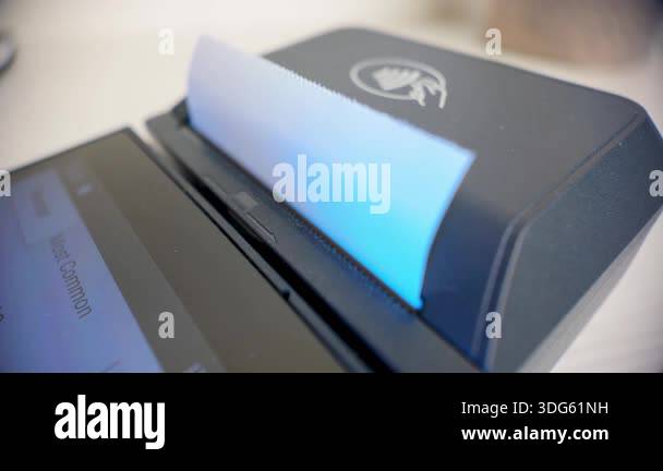 Close up of blank receipt printing from POS terminal during payment ...
