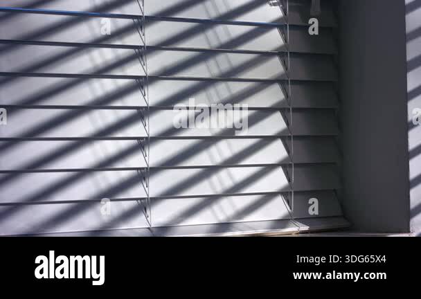 Venetian blinds window slats string in sunlight shadows medium 4k ...