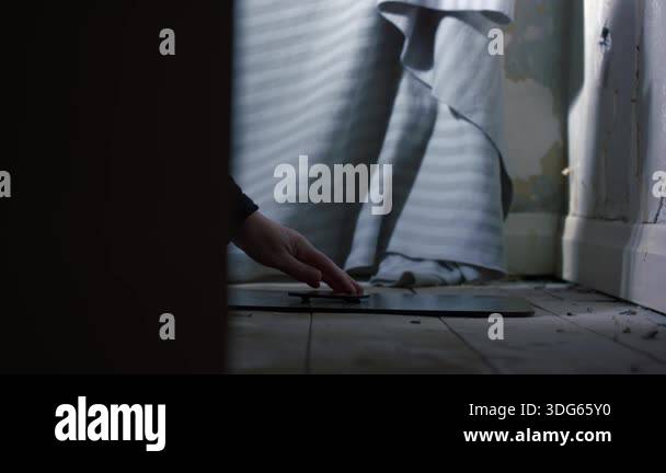 Door opens to reveal woman using spirit board in abandoned house medium ...