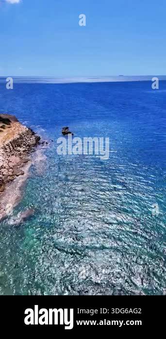 Aerial drone video of a small coastal gulf near Petrota Beach and ...