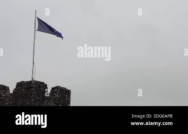 The flag of Europe is wavingg above Trim castle, the largest Anglo ...