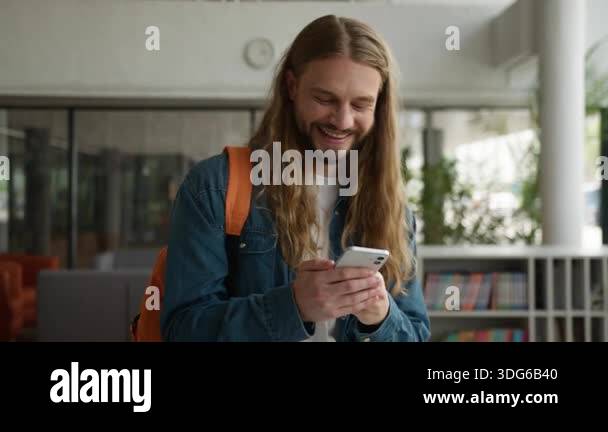 Caucasian man laughing humorous joyful fun holding mobile phone ...