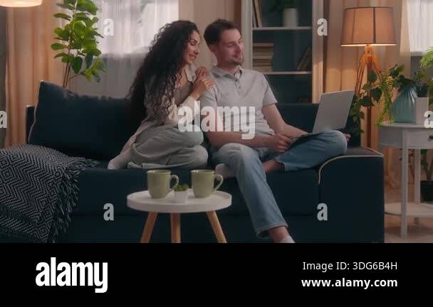 Multiethnic couple at home with Caucasian man and Hispanic woman making ...