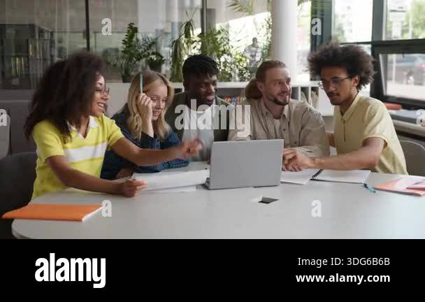 Team of five multiethnic diversity students studying with laptop ...
