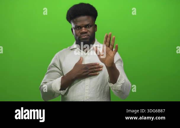 Young african american man with raised hand showing palm and other hand ...