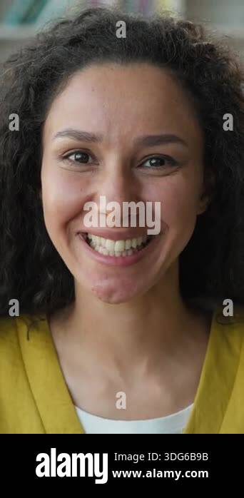 Happy Indian Caucasian woman smiling looking at camera in university ...