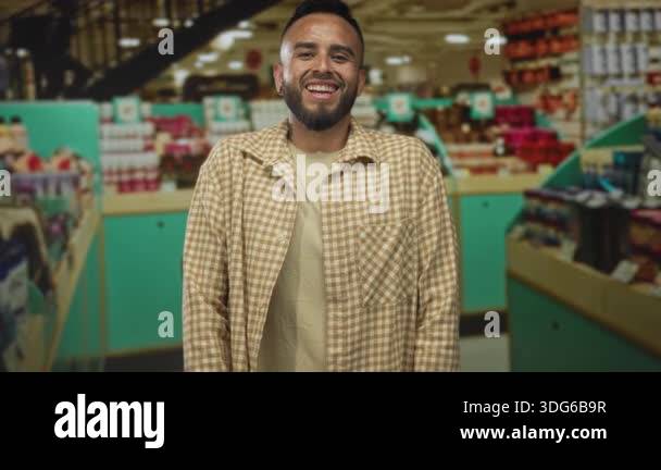 Man smiling broadly showing teeth, face framed by beard, wearing casual ...