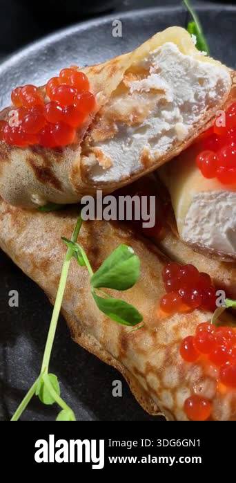 Traditional blini with cream cheese and red caviar.Maslenitsa Stock ...