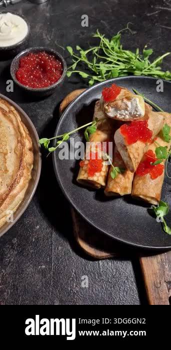 Traditional blini with cream cheese and red caviar.Maslenitsa Stock ...