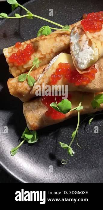 Traditional blini with cream cheese and red caviar.Maslenitsa Stock ...