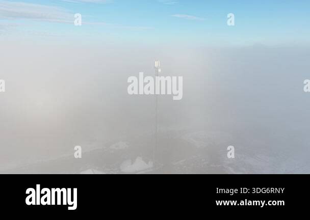 Radio relay antenna above a blanket of clouds Stock Video Footage - Alamy