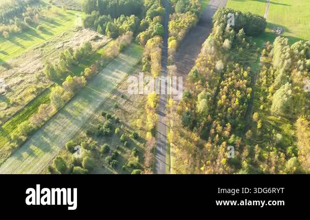 Autumn colors surrounding rural road Stock Video Footage - Alamy