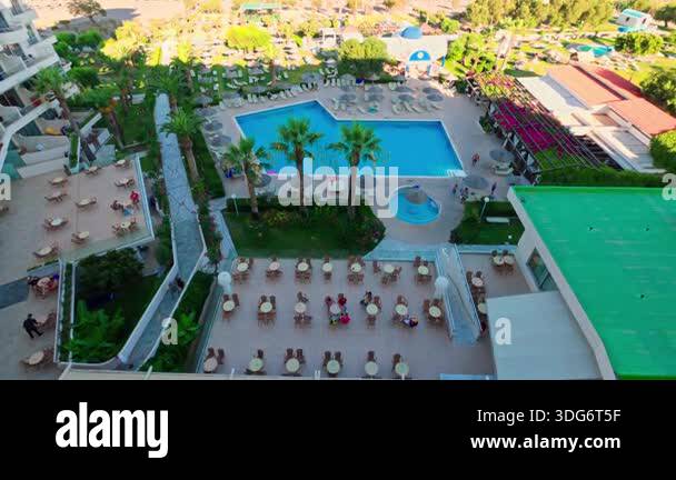 Beautiful top view of large resort hotel with swimming pool and palm ...