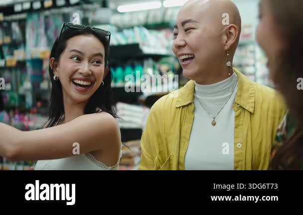 Young smiling asian women friends having a fun conversation while ...