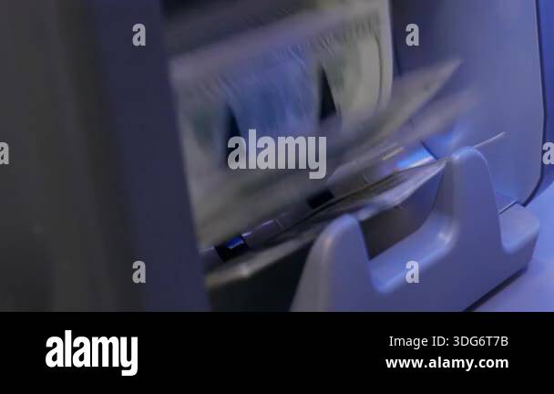 Close up of Cash Counting Machine Processing Banknotes of 100 Dollars ...