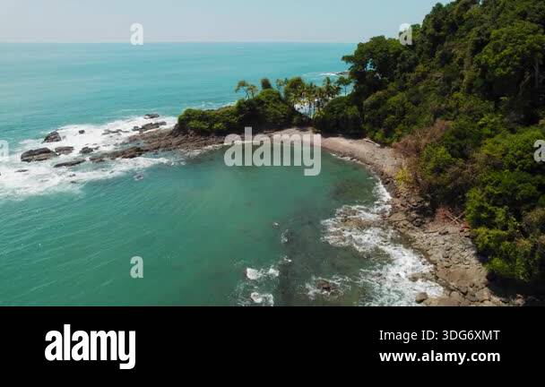 Aerial view of rocky cove and turquoise ocean water on Costa Rica coast ...