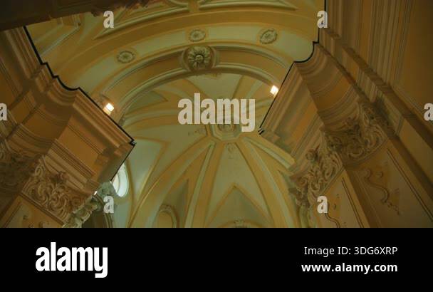 Baroque interior with arched ceiling and ornate stucco decorations, big ...