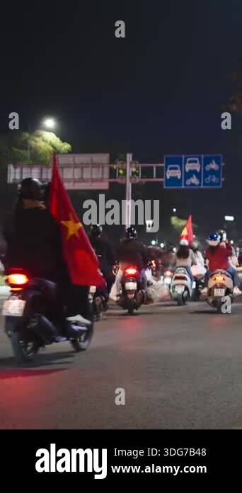 Enthusiastic fans celebrating a national soccer team victory, riding ...