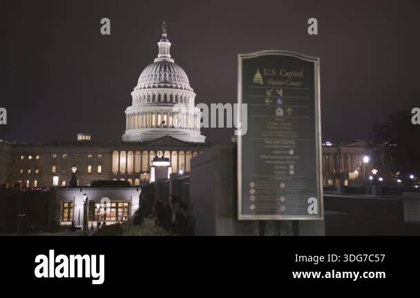 Congress hall illuminated. US Capitol under dark sky. Night lights on ...