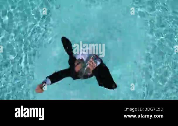 Creative summer business scene. Wet business man in suit with laptop ...