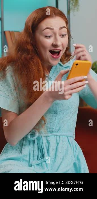 Happy woman use mobile smartphone typing browsing say Wow yes found out ...