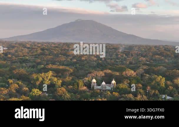 Church in jungle background with Mombacho volcano in Nicaragua aerial ...