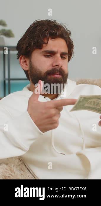 Portrait of poor Indian Arabian man upset over insufficient amount of ...