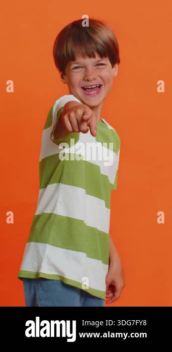 Happy preteen child boy kid laughing out loud after hearing ridiculous ...