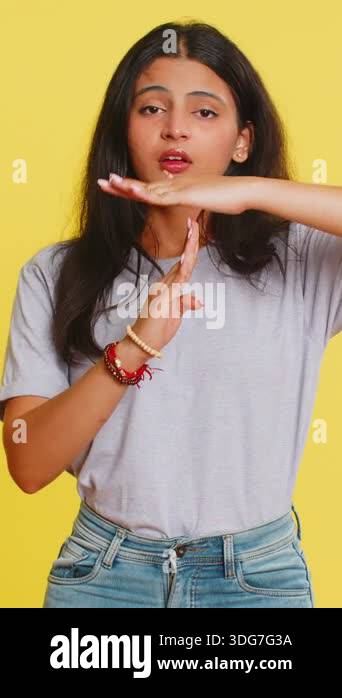 Tired serious upset Indian young woman showing time out gesture, limit ...
