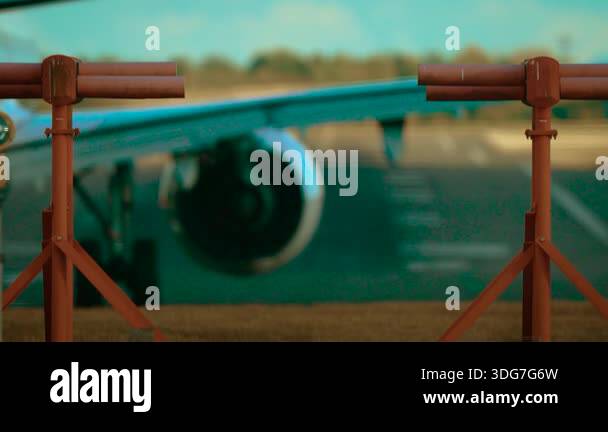 Jet warming turbines on runway with glide path masts in foreground ...