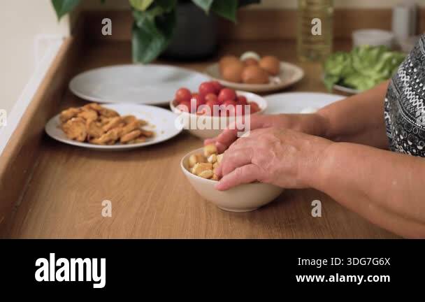 Mixing crunchy croutons for preparing Caesar salad. Stirring bread ...