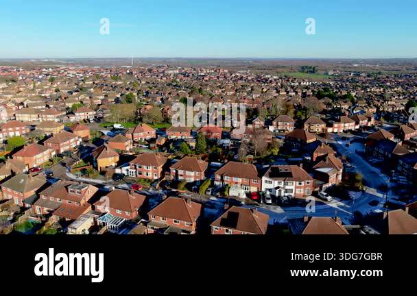 English countryside town expanding with suburban housing neighborhoods ...