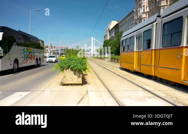 Budapest, Hungary - May 3, 2025: Iconic yellow Budapest tram number 2 ...
