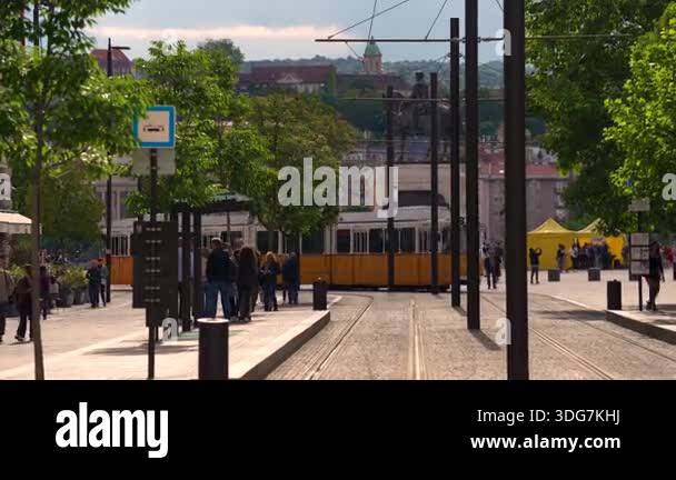 Budapest, Hungary - May 24, 2025: A scenic view of a yellow tram ...
